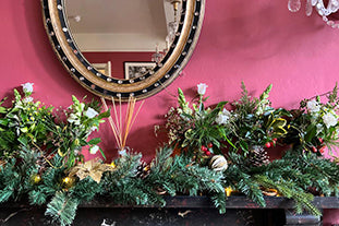 Adding fresh posies to a garland– Common Farm Flowers